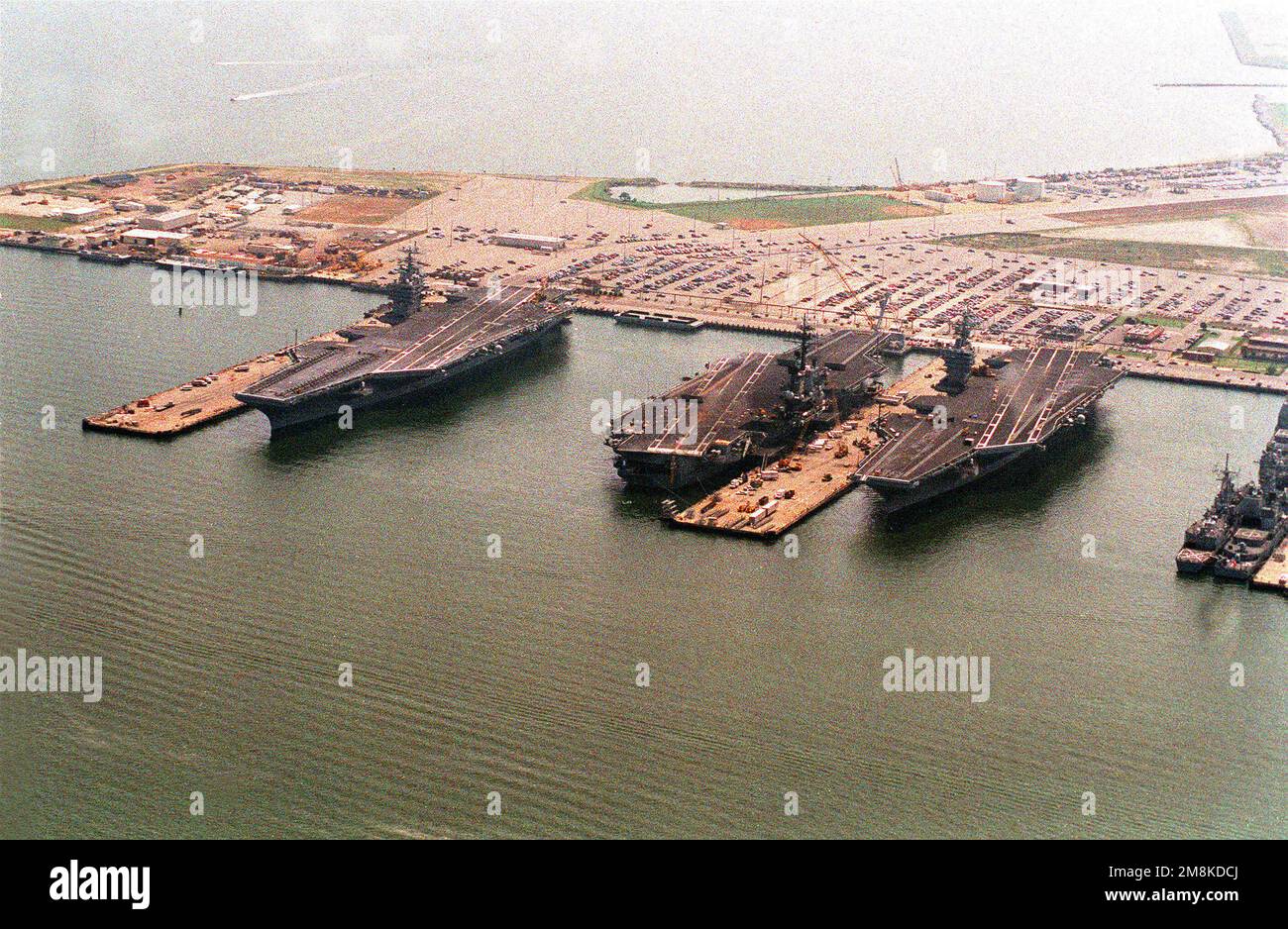 An aerial view of piers 11 and 12 at the Naval Station. On the left is ...