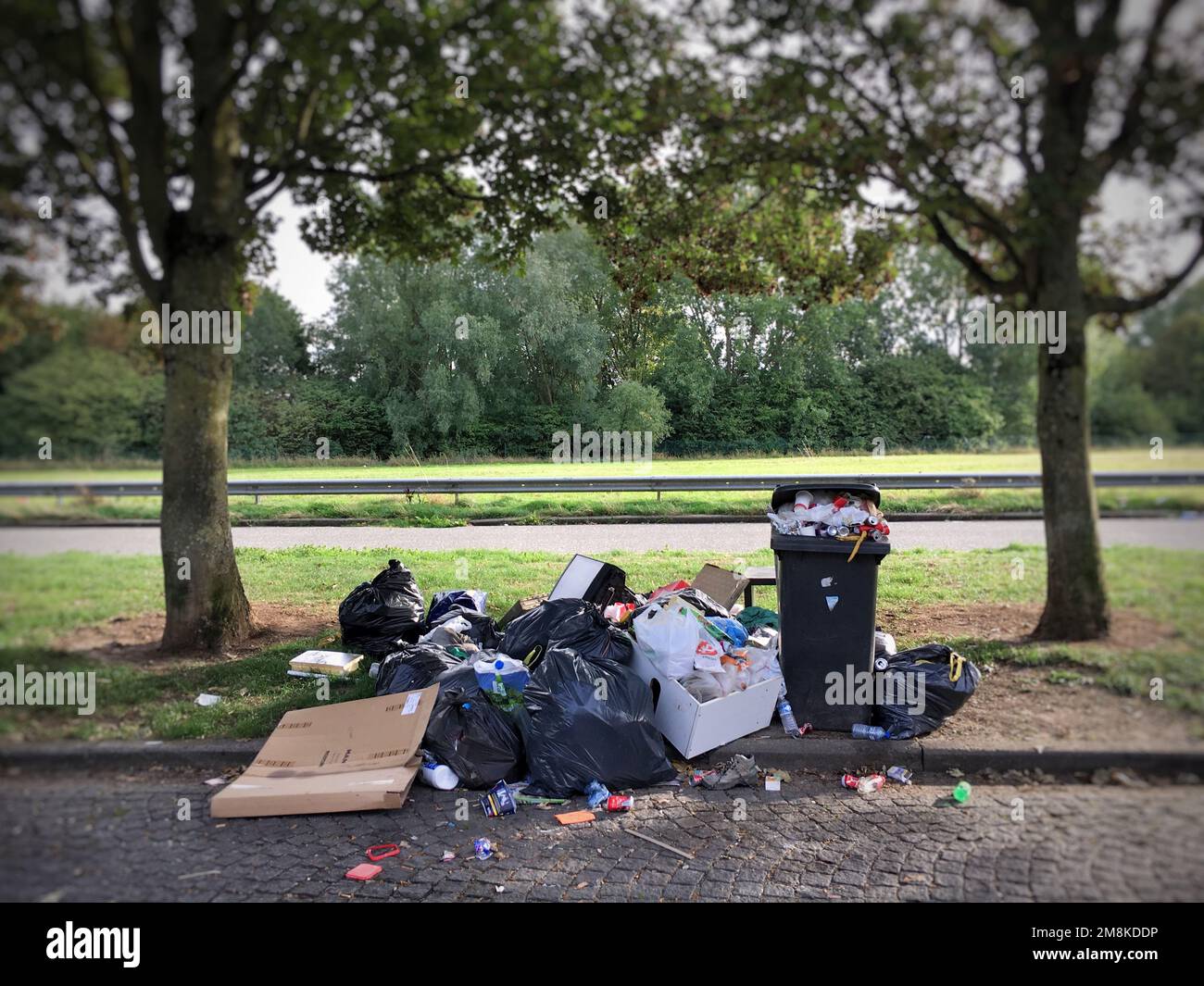 pile of garbage at the edge of a road Stock Photo - Alamy