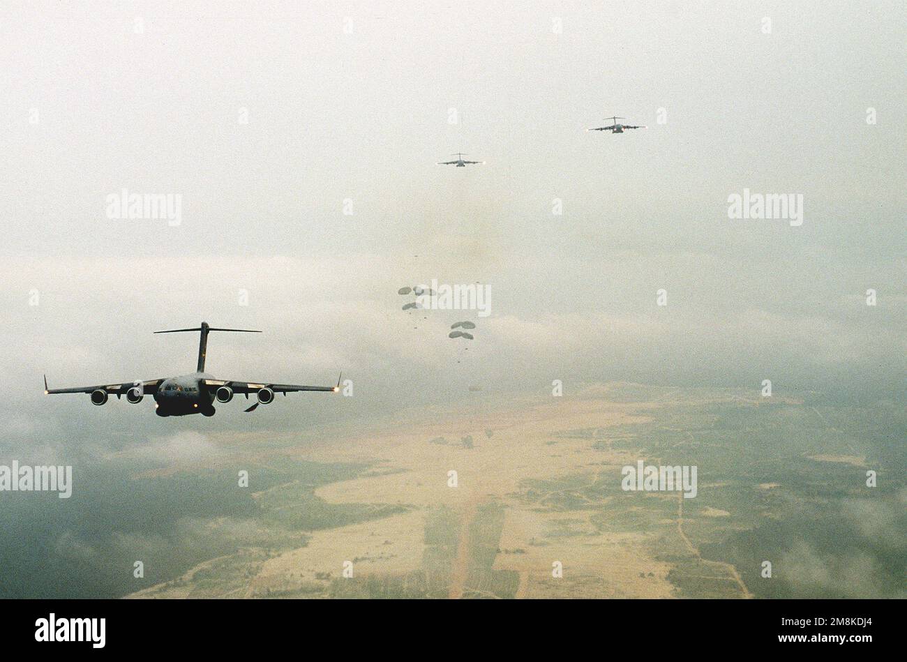 A U.S. Air Force C-17 Globemaster III clears the drop zone after air ...