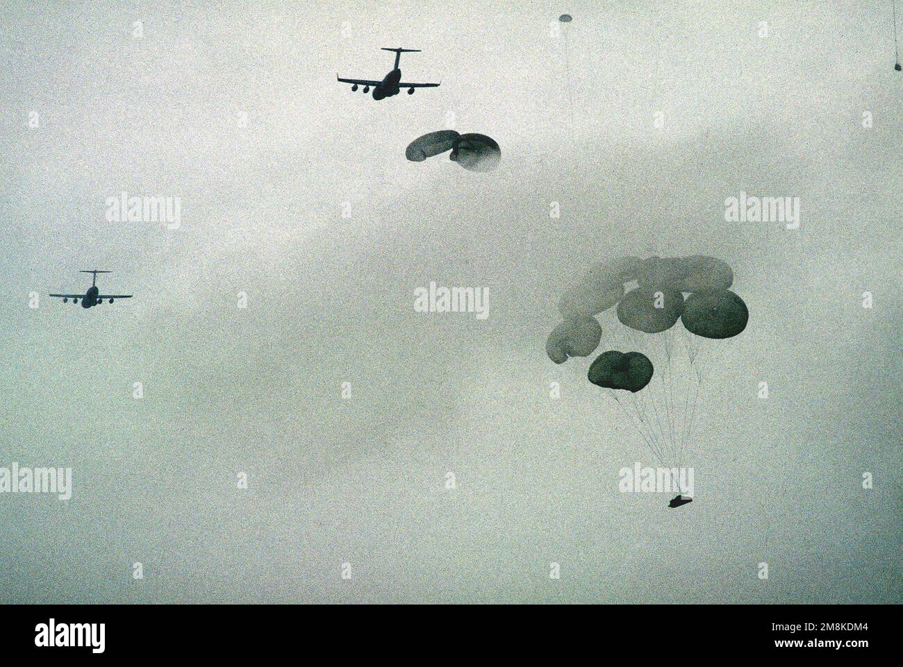 A U.S. Air Force C-17 Globemaster III clears the drop zone after air ...