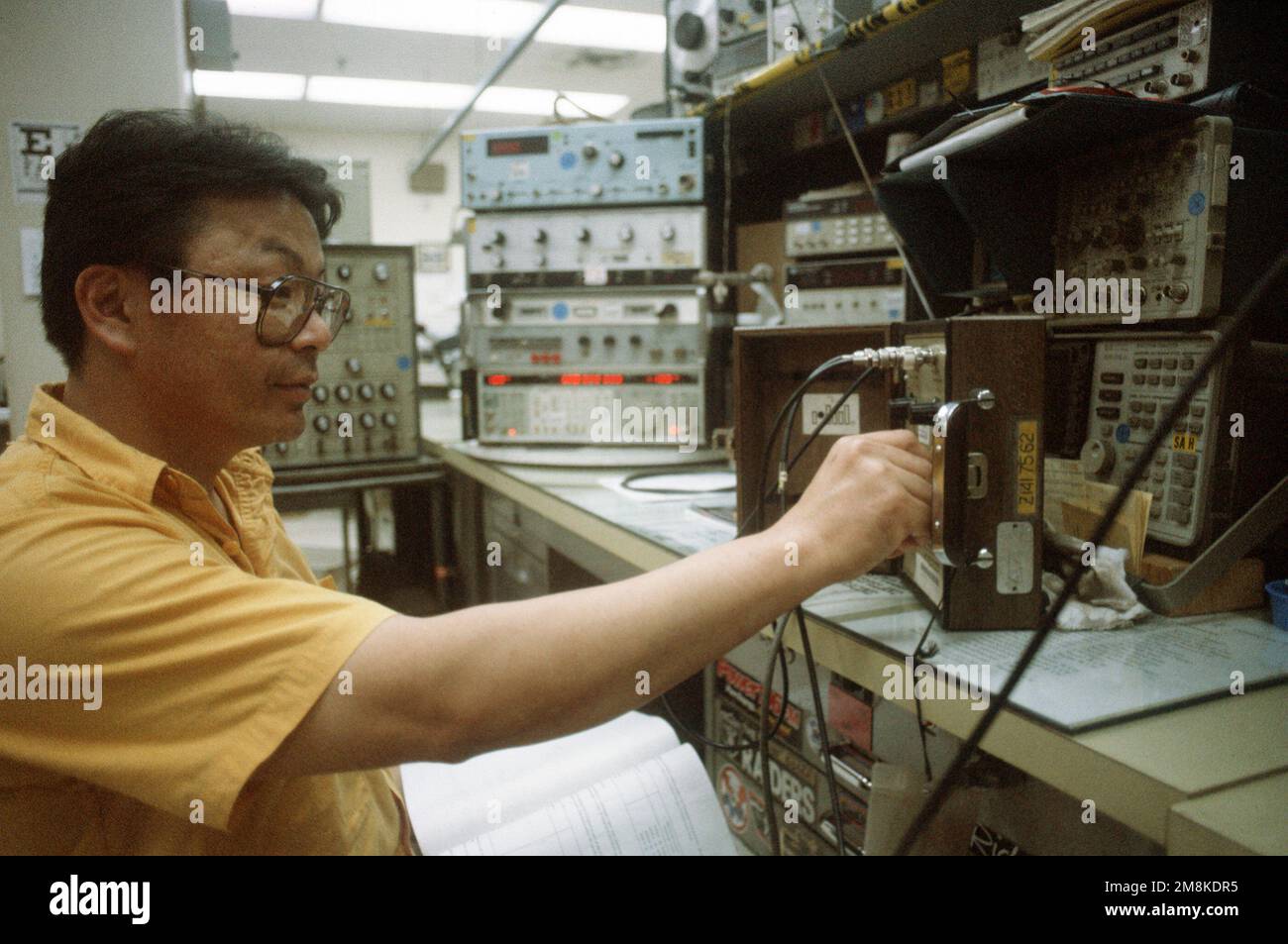 Mr. Y. Kawanari works in the calibration lab at the Long Beach Naval ...