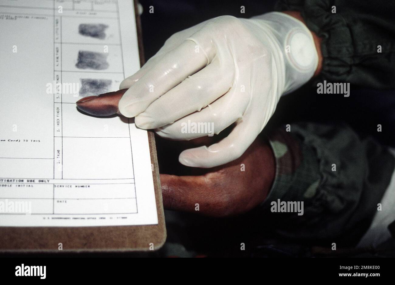 Close up view as Mortuary member take the fingerprint of a simulated ...