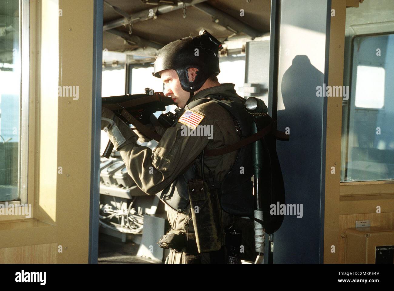 A US Navy SEAL sets up a security perimeter around the command post ...