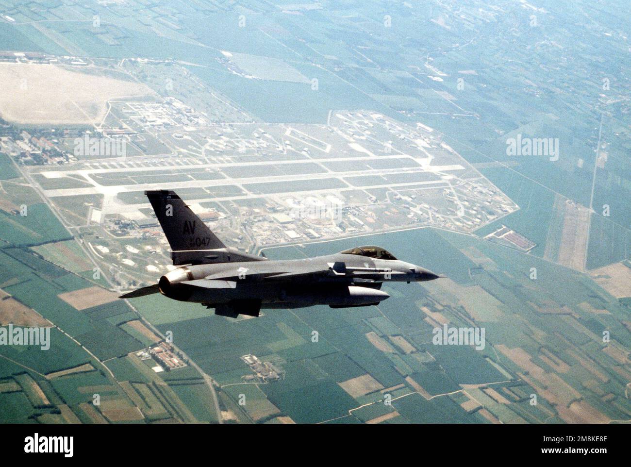 An air to air right side view of an United States Air Force F-16C ...
