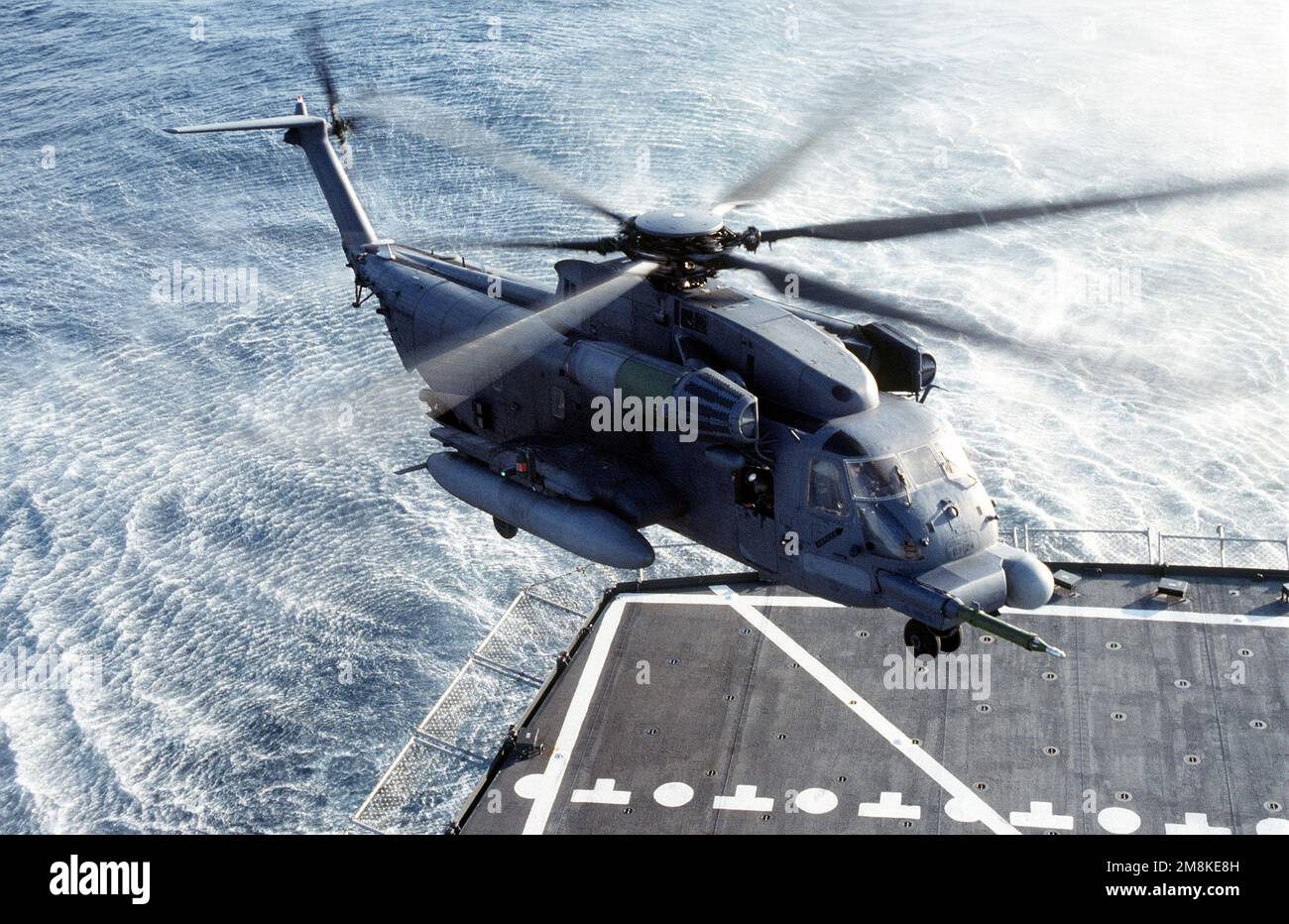 A U.S. Air Force MH-53 Pave Low helicopter approaches the flight deck ...