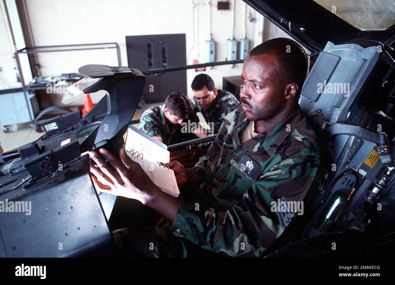 USAF Crew CHIEF STAFF Sergeant Earl Sharpe sits in the cockpit of an F ...