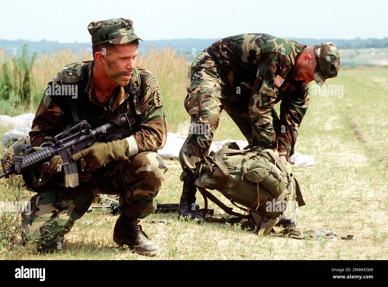 SGT. 1ST Class Smith (left), 10th Special Forces Group, armed with an ...