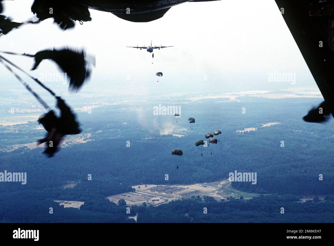 US Army and Hungarian paratroopers perform a static line jump from a C ...