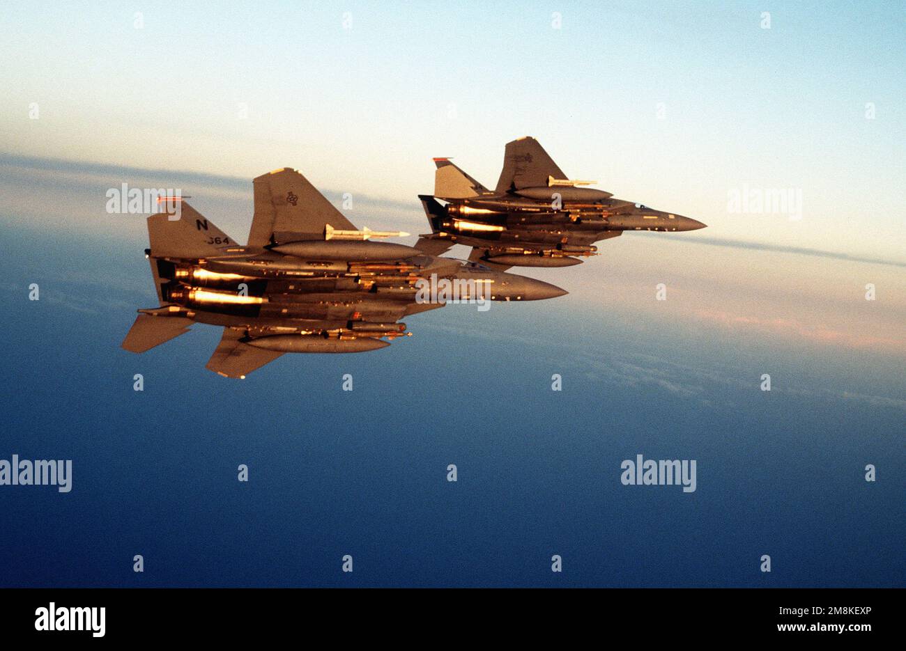 An air to air right underside view of two US Air Force F-15E Strike ...