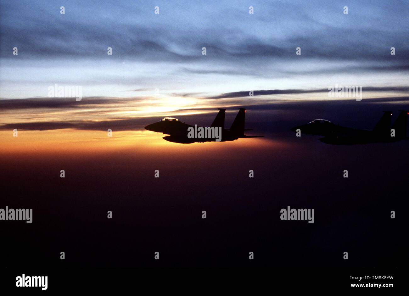 A silhouette of two US Air Force F-15E Strike Eagles from the 494th ...