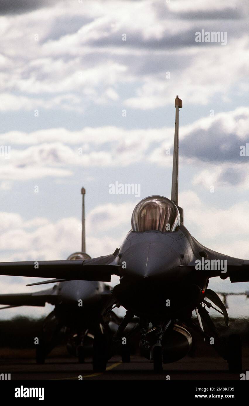 A close-up front view of a pair of F-16 Fighting Falcons from the 13th ...