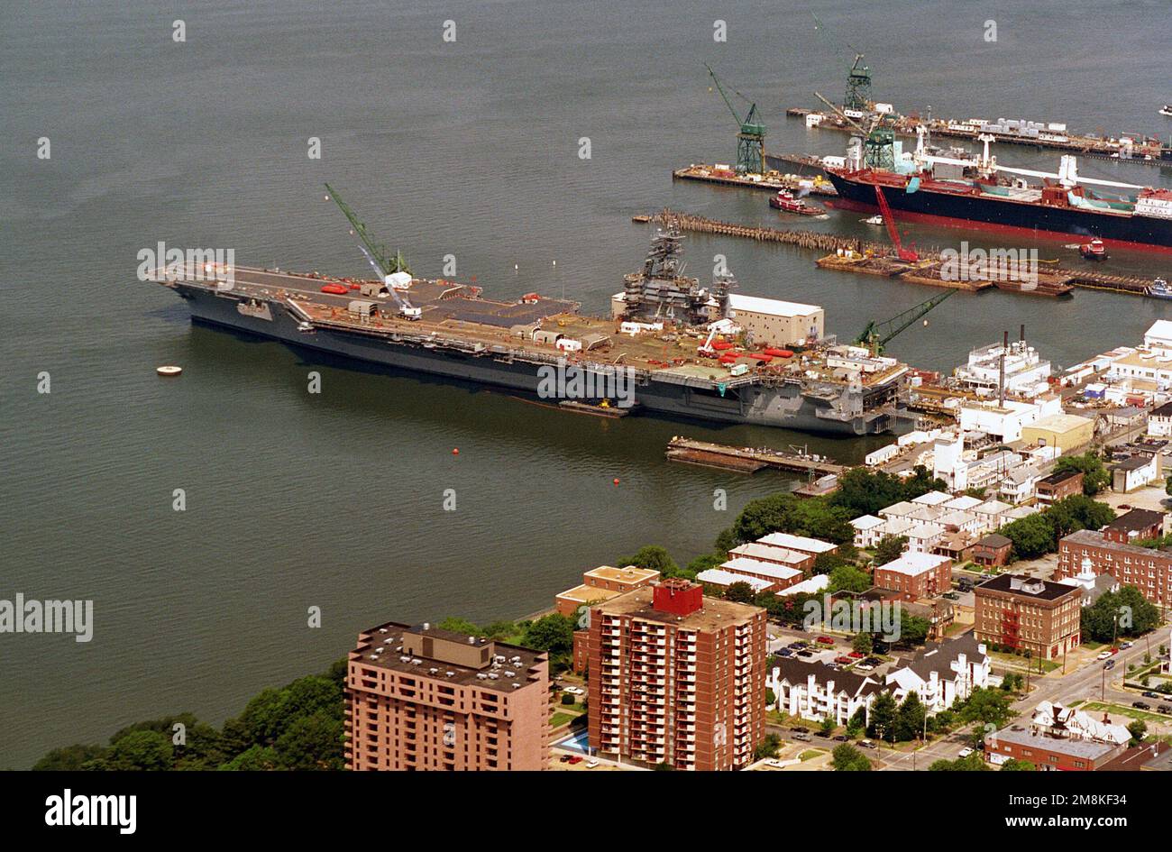 An aerial port side view of the nuclear-powered aircraft carrier JOHN C ...