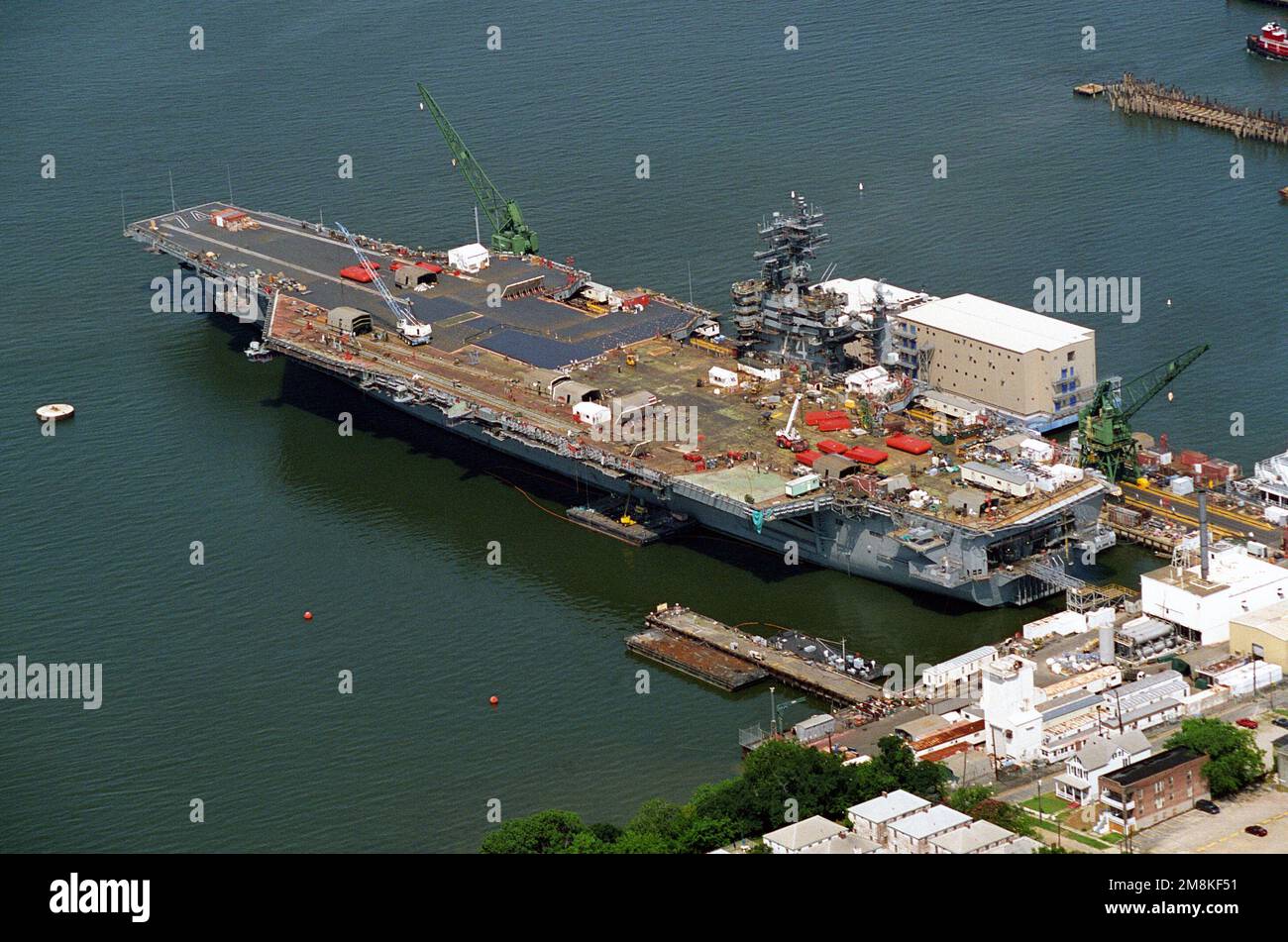 An aerial port quarter view of the nuclear-powered aircraft carrier JOHN C. STENNIS (CVN-74 ...