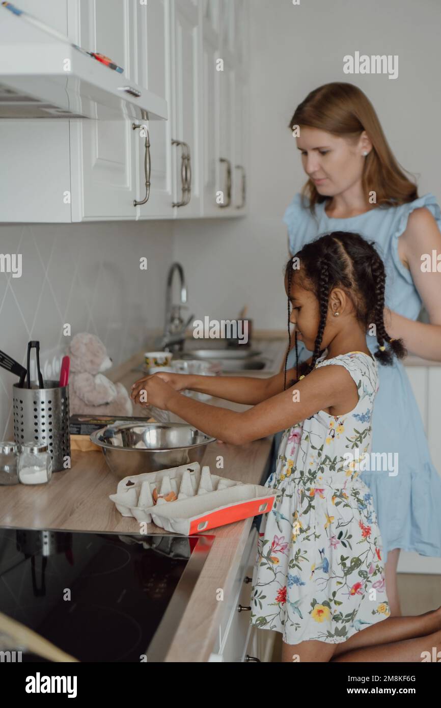 The Hispanic mother and daughter cooking in the kitchen Stock Photo - Alamy