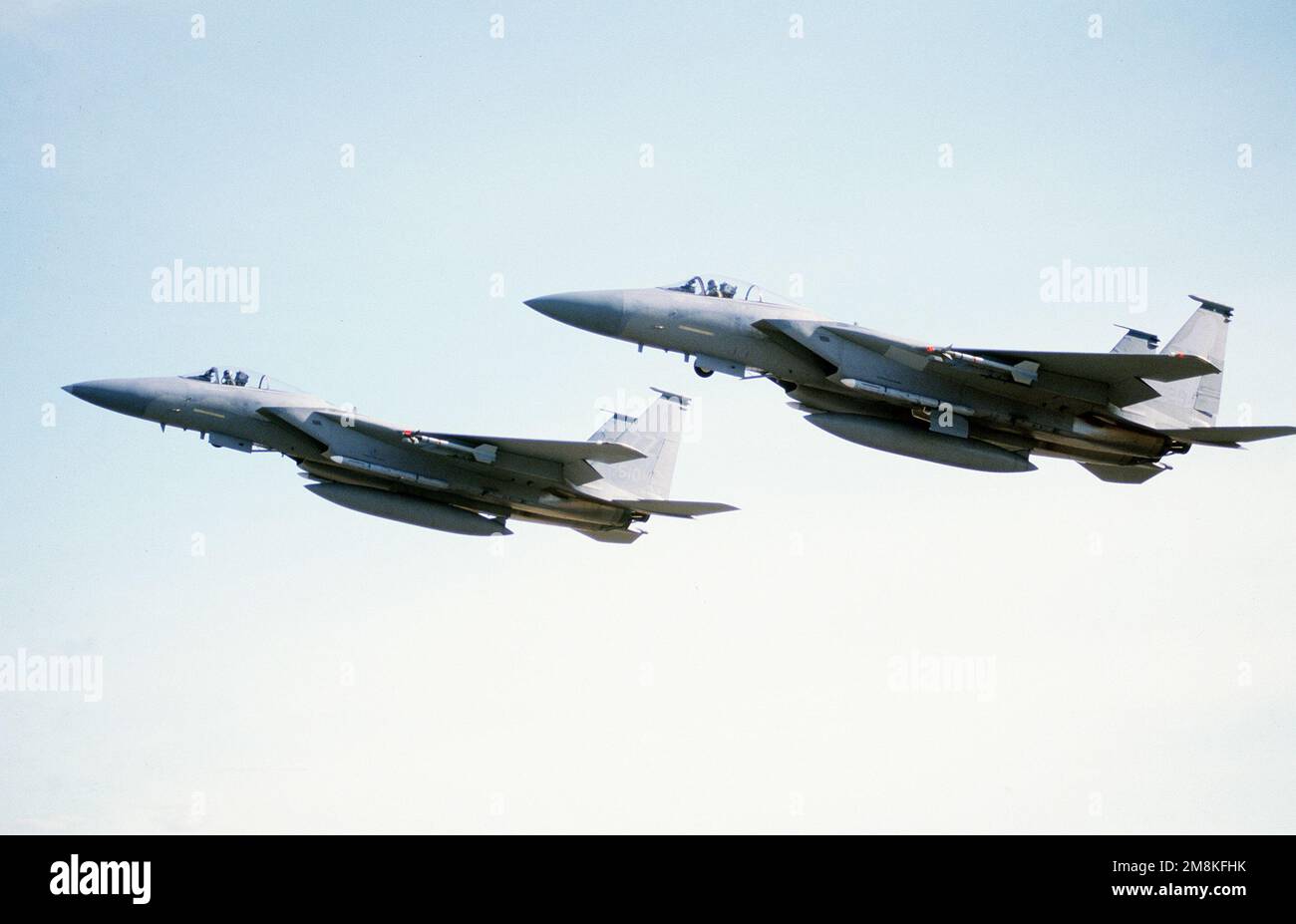 An air-to-air right side view of a pair of F-15 Eagles from the 44th ...