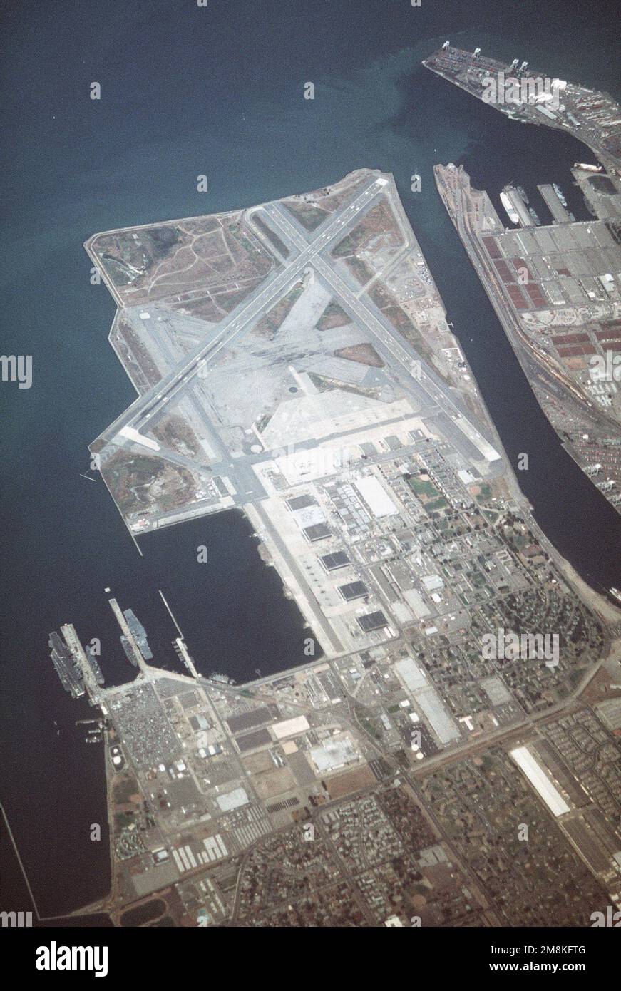 High oblique aerial view of the Naval Air Station Alameda, looking west ...