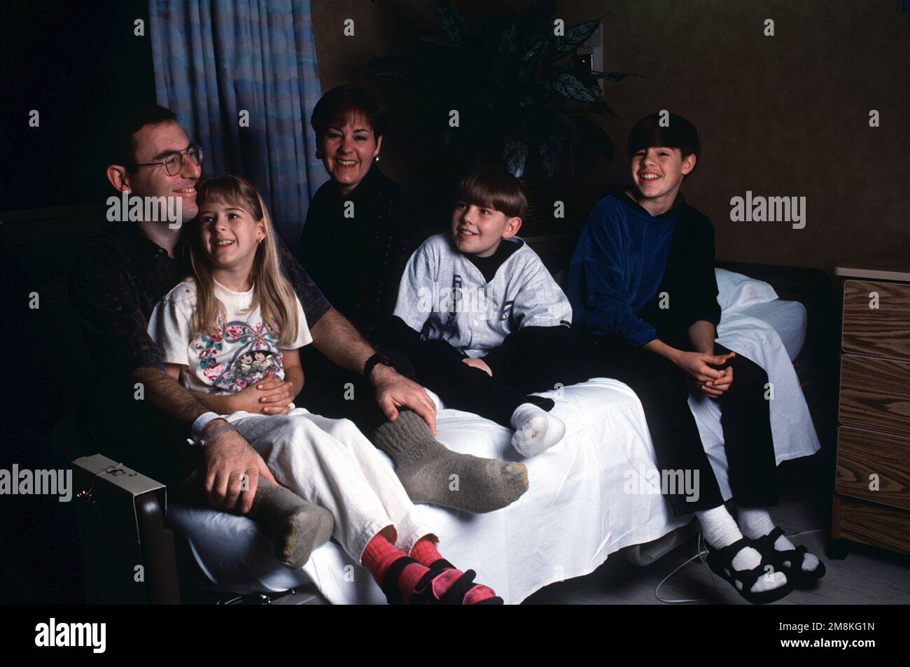USAF Lieutenant Colonel (LTC) Michael R. Couillard is surrounded by his ...