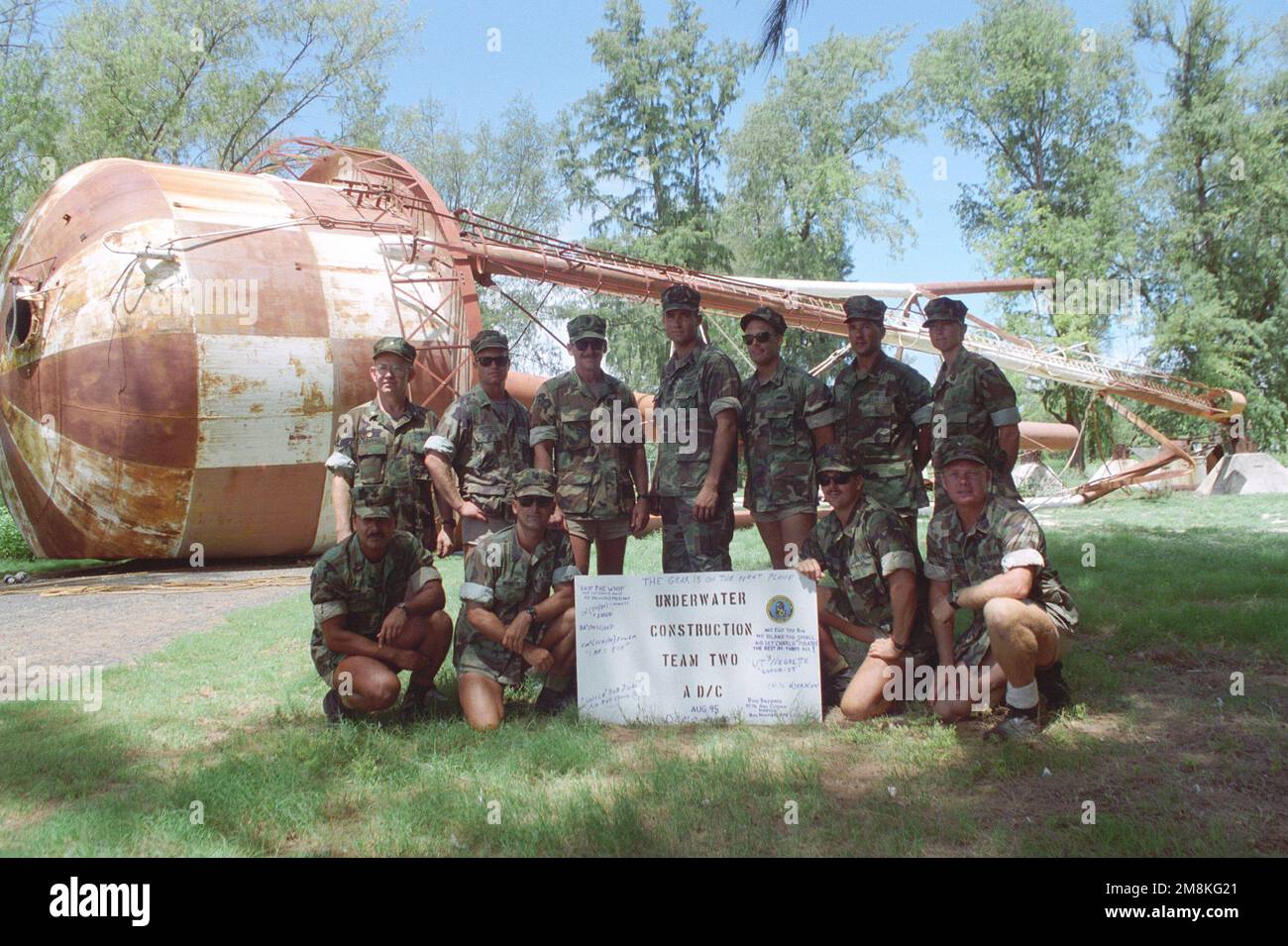Eleven members of Underwater Construction Team Two (UCT-2) pose for a ...