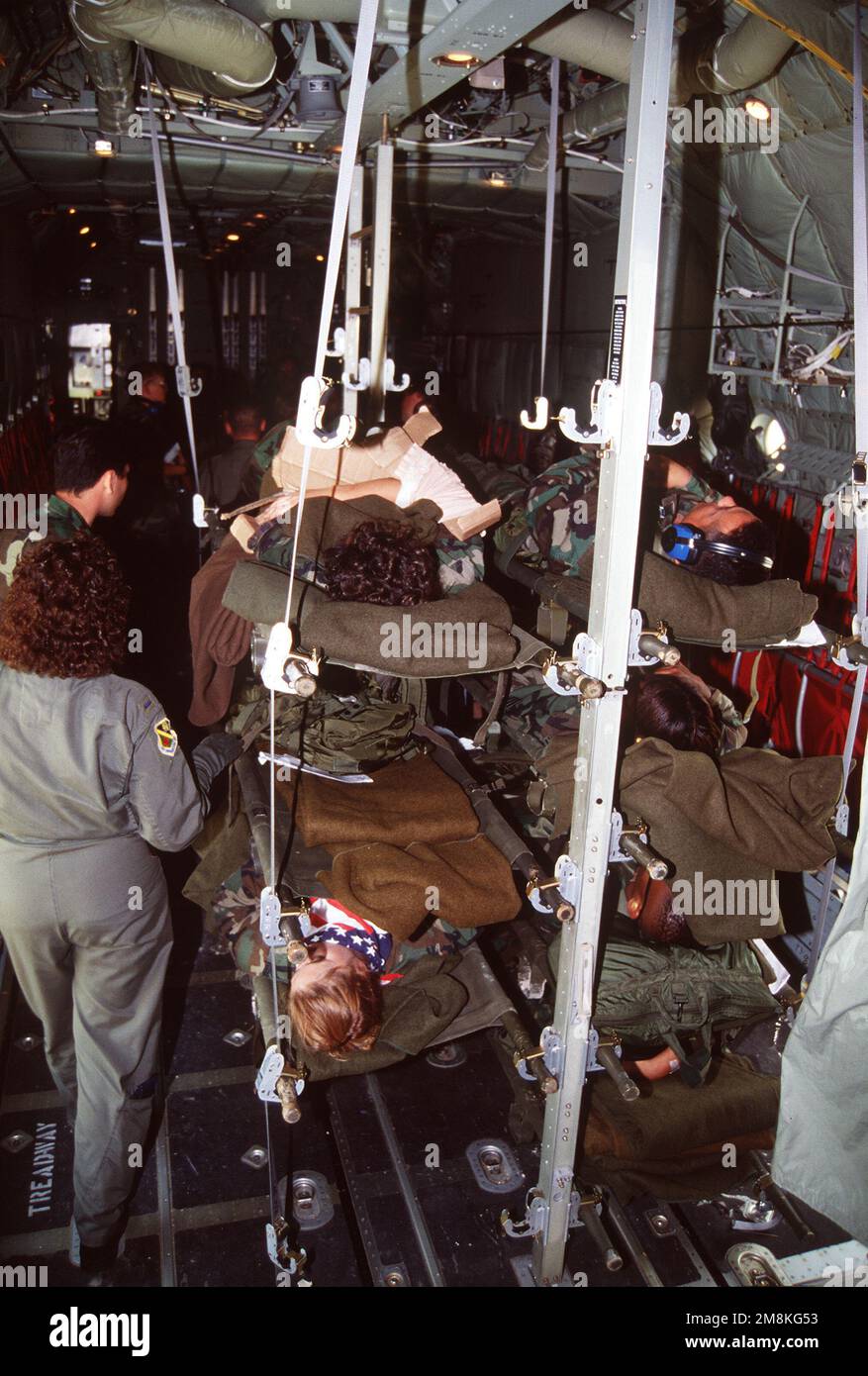 Stretcher bound "simulated" patients on a C-130, configured for medical ...
