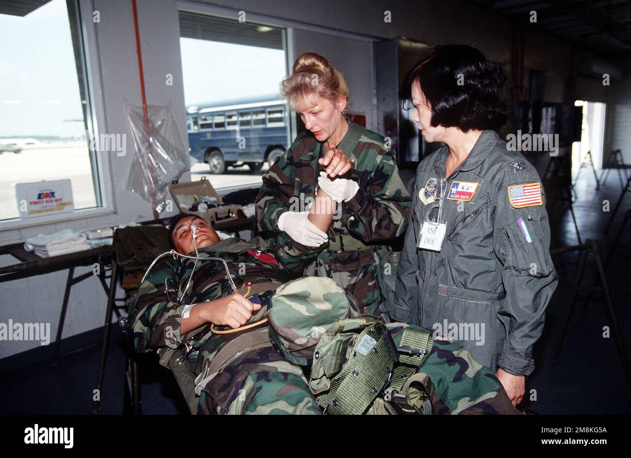 In the Aeromedical Staging Facility, Colonel Maggie Beato, (right ...