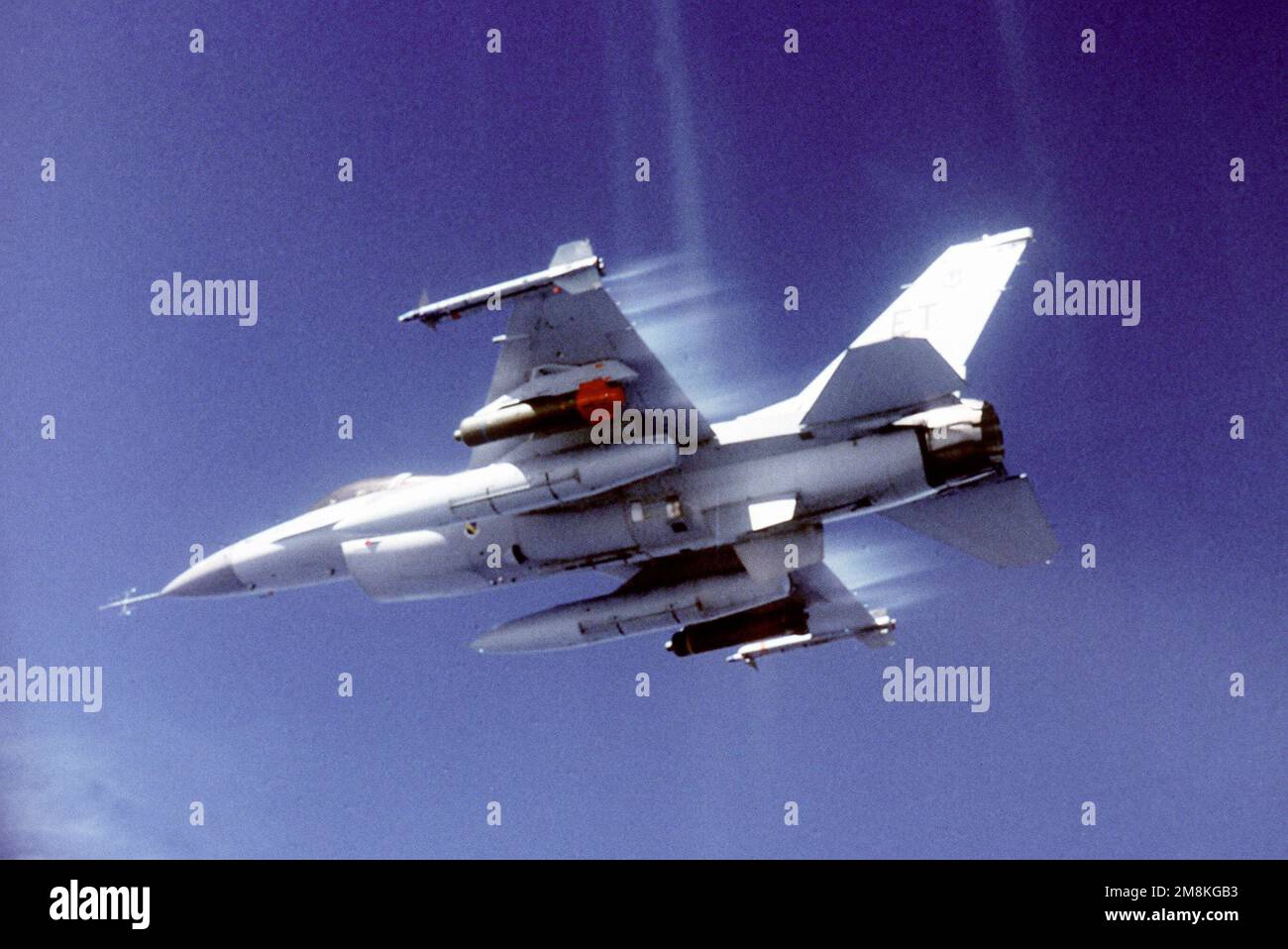 F-16 No. 353 in flight with the Wind Corrected Munitions Dispenser ...