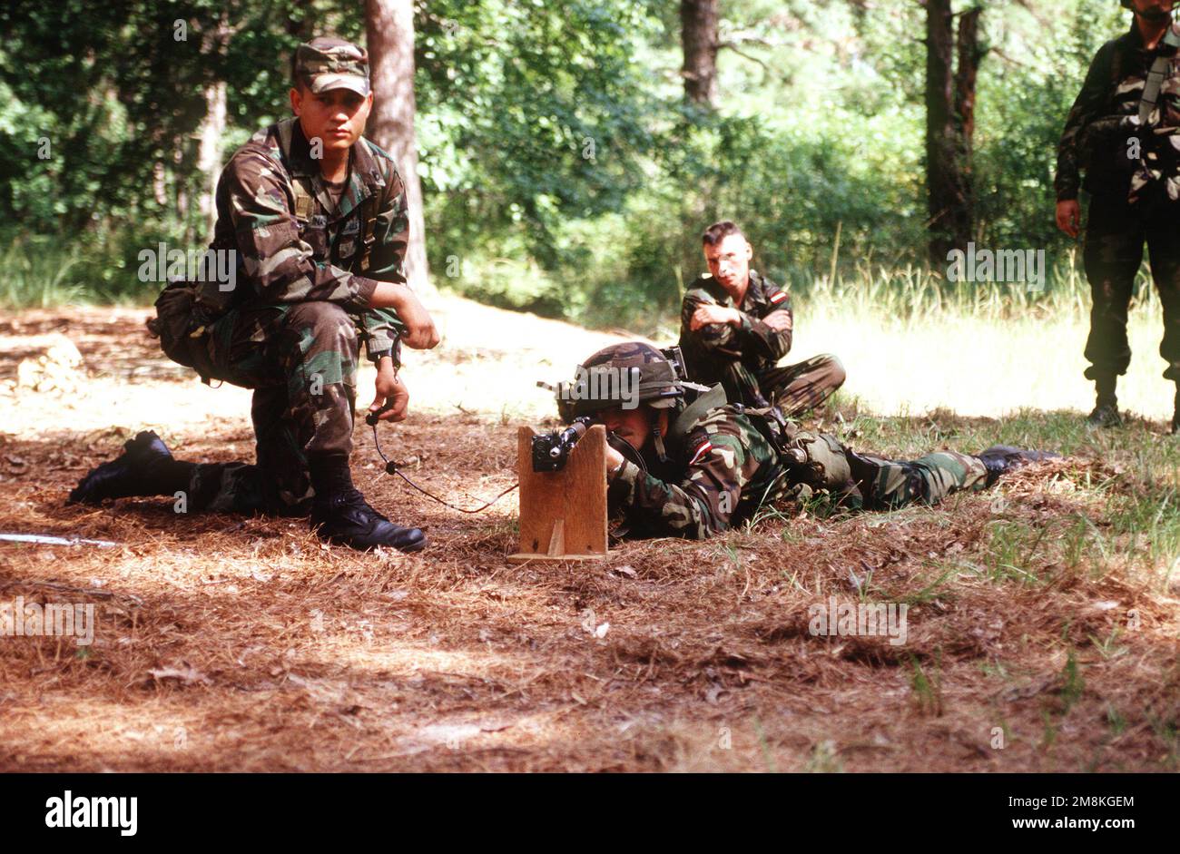 A soldier zeroes in his AK-47 using the Multiple Integrated Laser ...