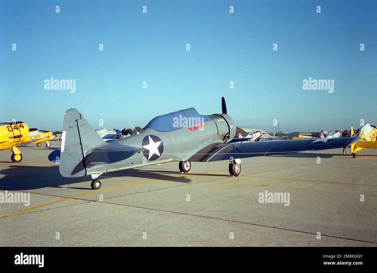 A right rear view of an SNJ Texan aircraft, in a 1941 paint scheme ...