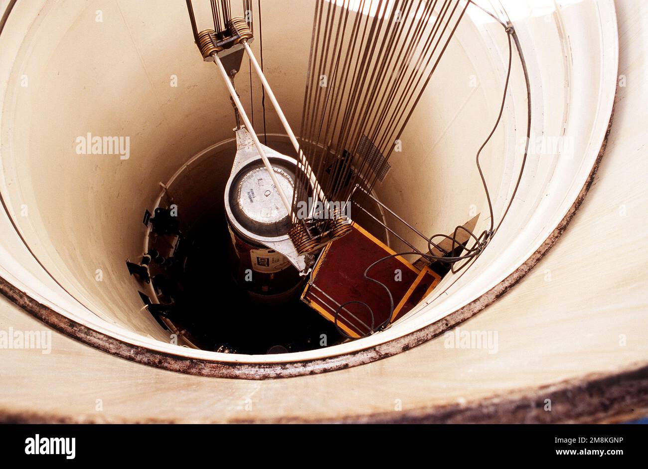 At the Launch Facility, cables are lowered down the launch tube to the ...