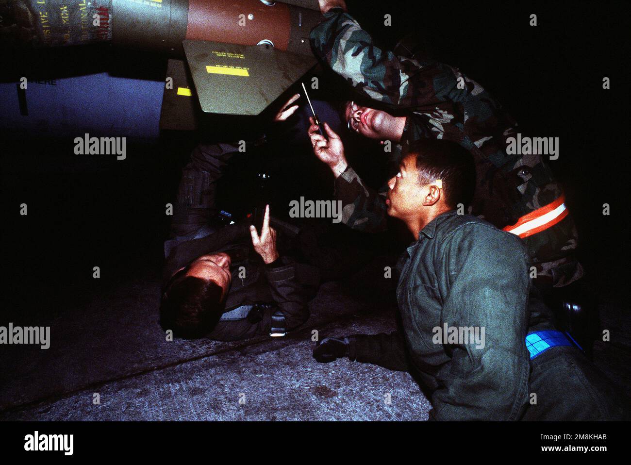 US Air Force weapon loaders load an AGM-123 Skipper air to surface ...