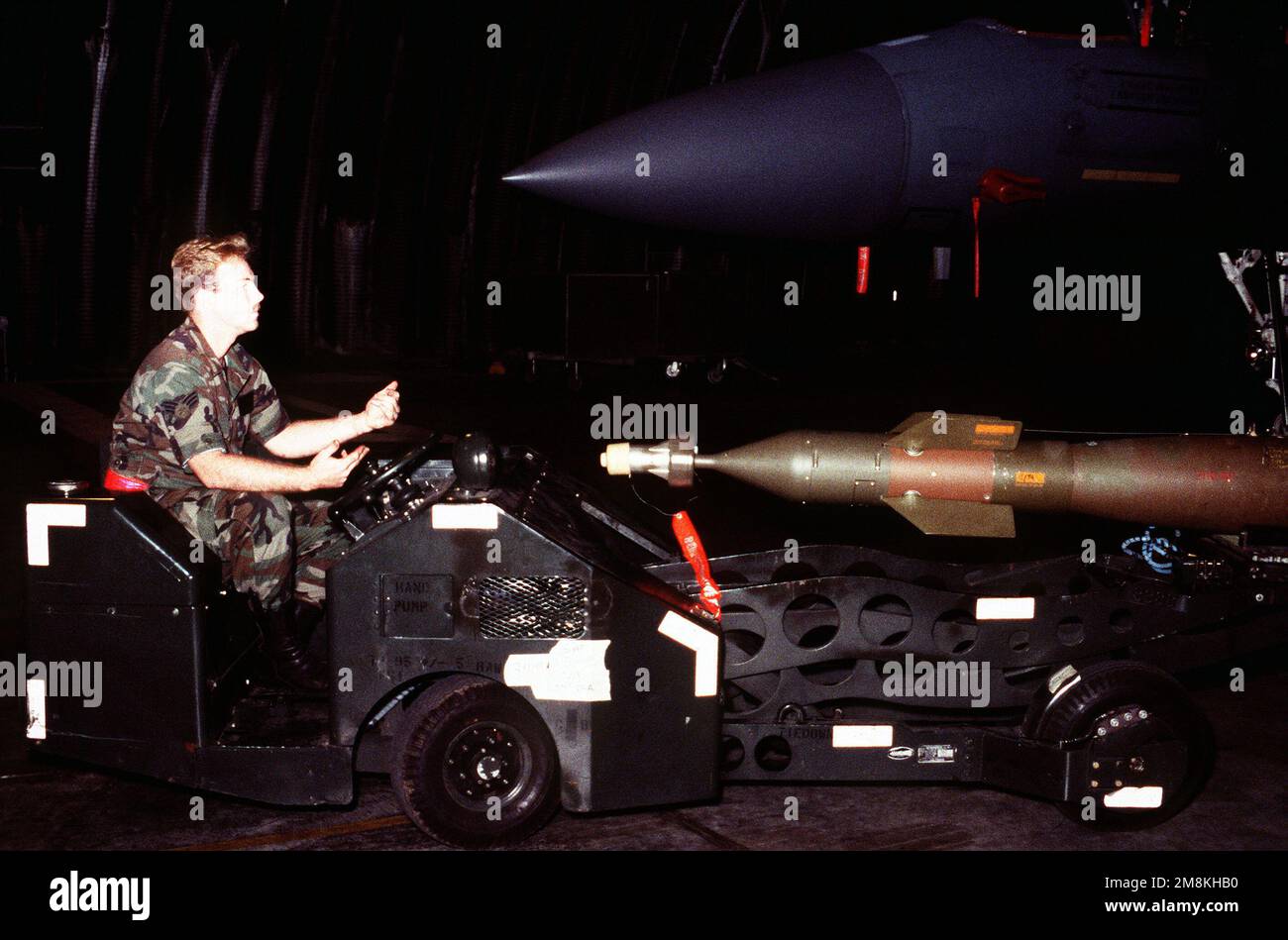 US Air Force weapon loaders load an AGM-123 Skipper air to surface ...