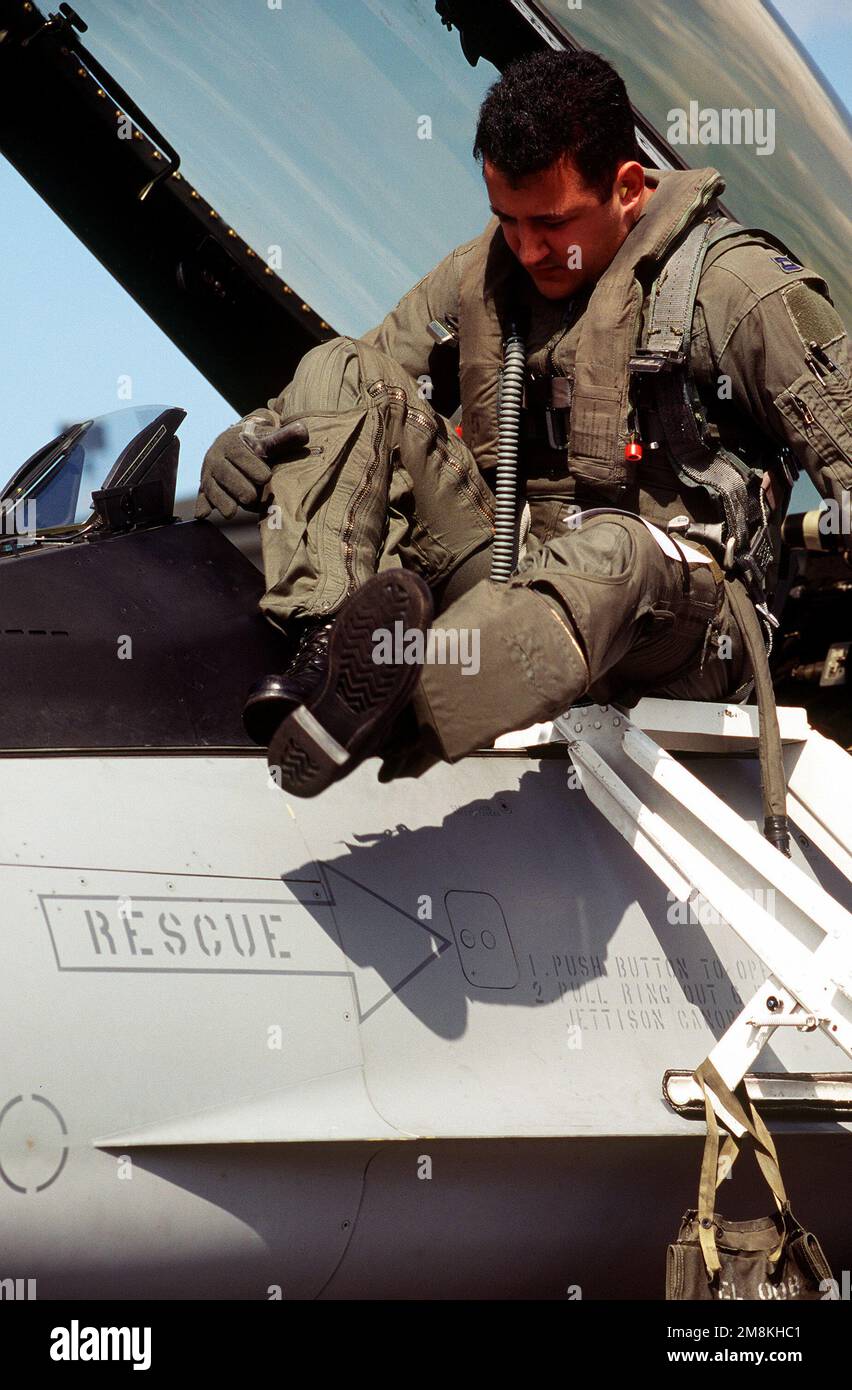 A pilot from the 22nd Fighter Squadron, Spangdahlem AB, Germany, boards ...