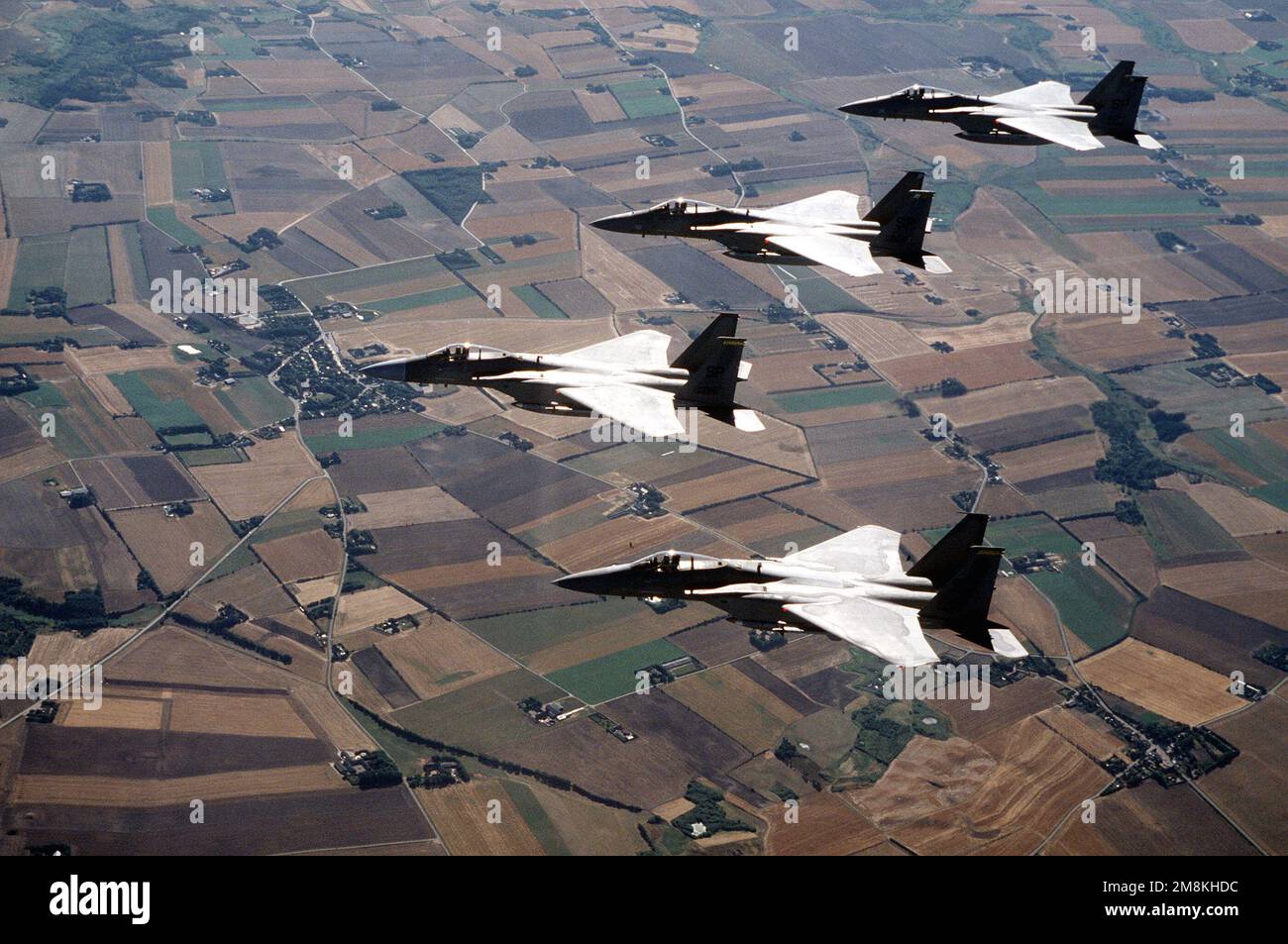 F-15 Strike Eagles from the 53rd Fighter Squadron fly in a finger tip ...