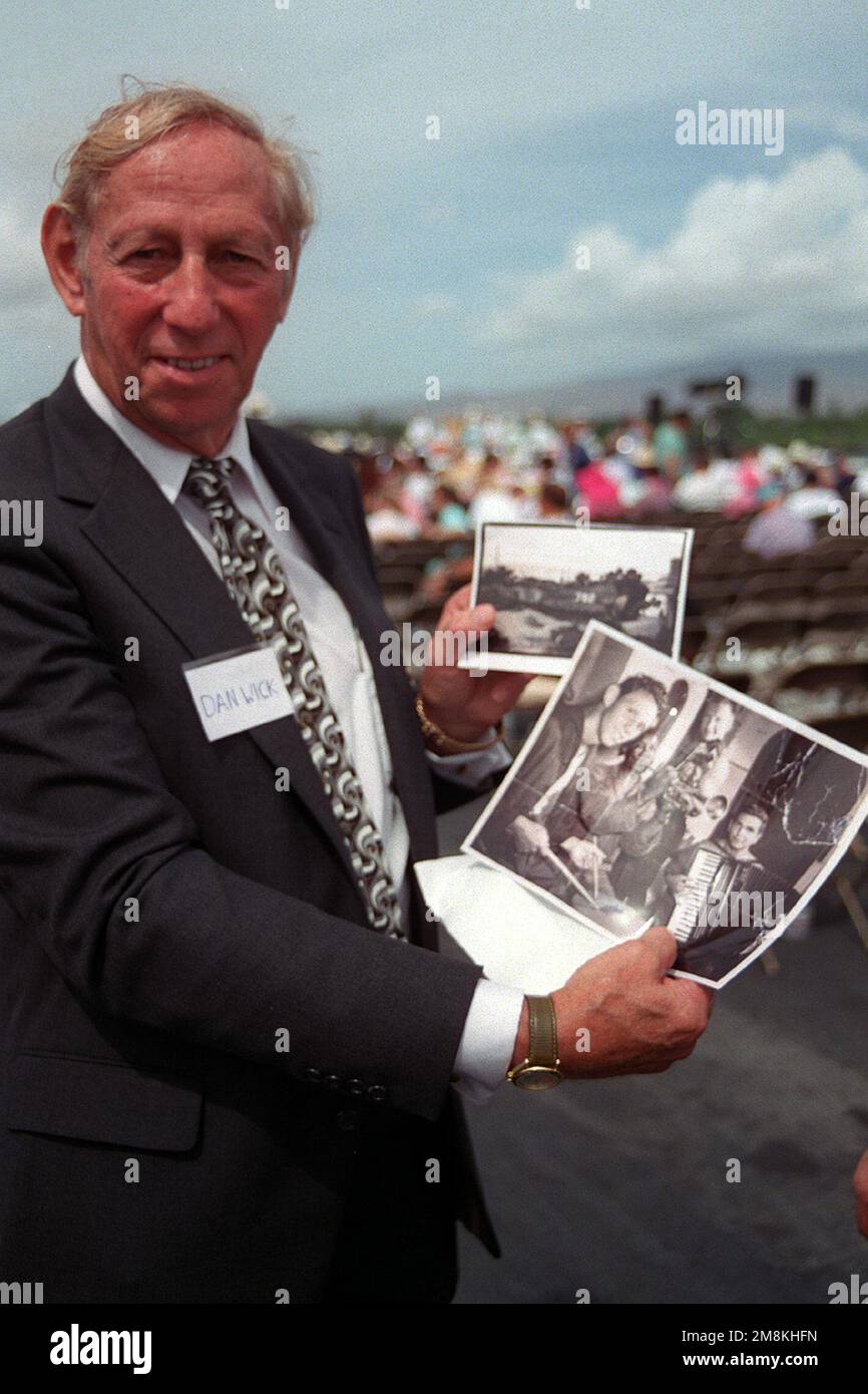 World War II Veteran Dan Wick poses with his treasured photographs of ...
