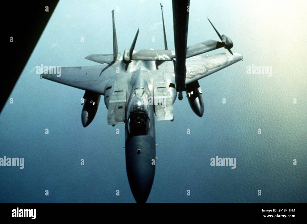 A US Air Force F-15 Eagle makes an approach to a KC-135 Stratotanker ...