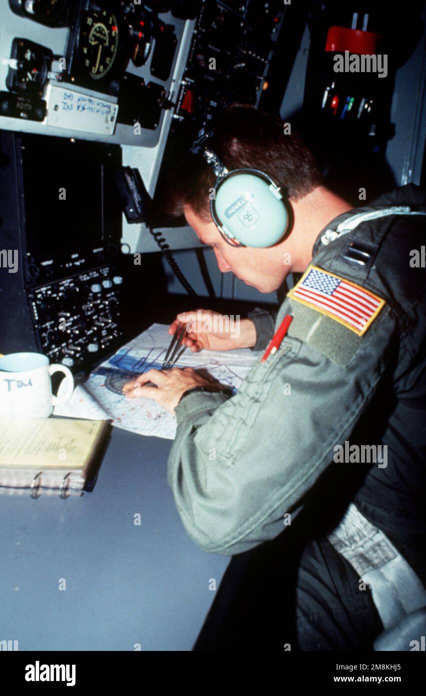 CAPT. Tim Howell, a KC-135 Stratotanker navigator, plots location and ...