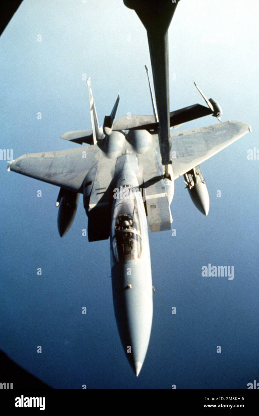 A US Air Force F-15 Eagle connects to the refueling boom of a KC-135 ...