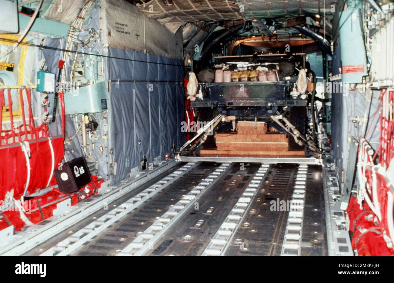 US Air Force ground crews push a High-Mobility Multipurpose Wheeled ...