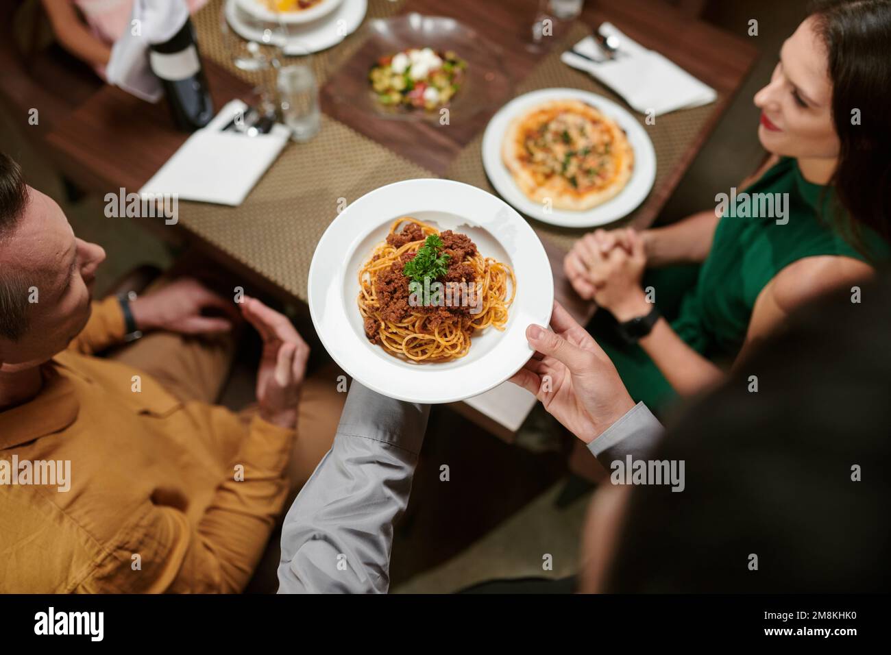 Family eating spaghetti bolognese hi-res stock photography and images ...