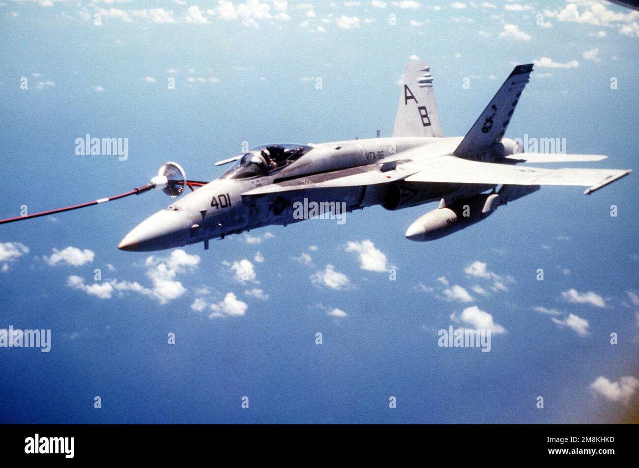 An air to air view of a US Navy F/A-18 Hornet as it receives aerial ...