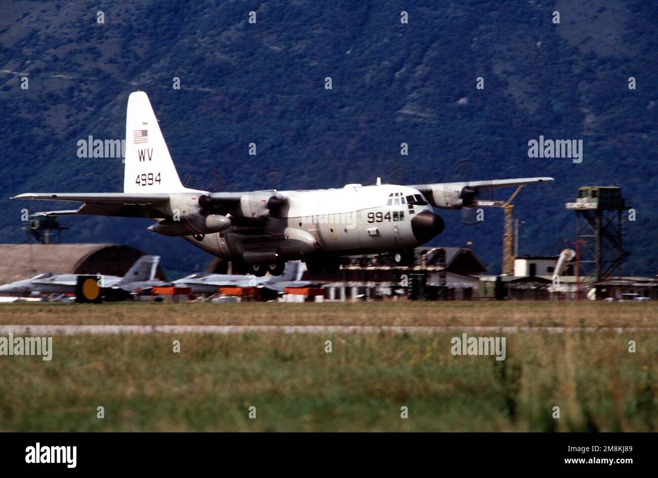 A close in shot of a US Navy C-130 Hercules aircraft as it takes off in ...