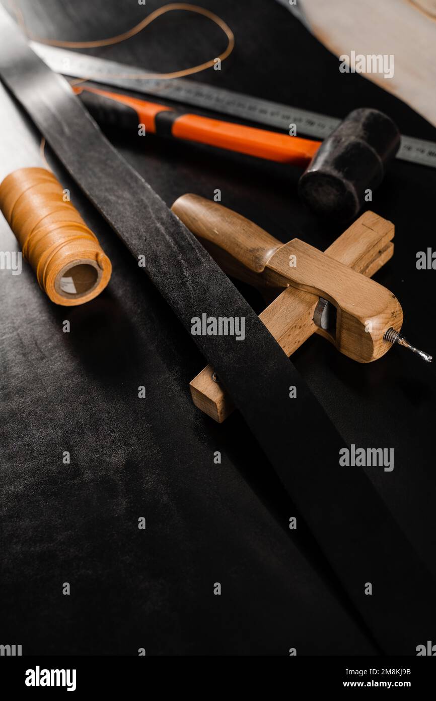 Genuine leather belt, thread, hammer and ruler. Tools of craftsman for ...