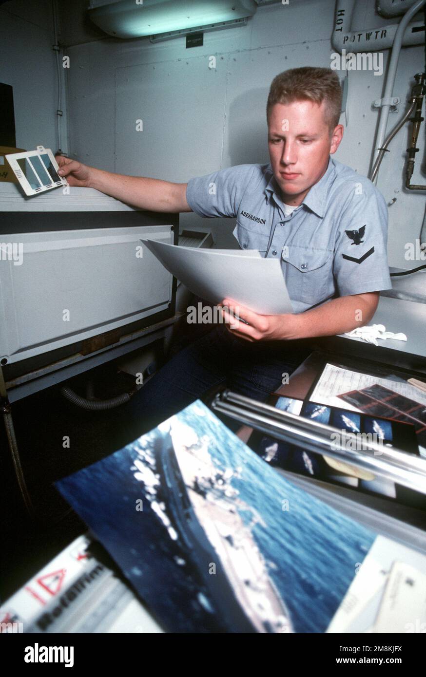 Photographers Mate Third Class (PH3) Arlo K Abrahamson of X-2 Division ...