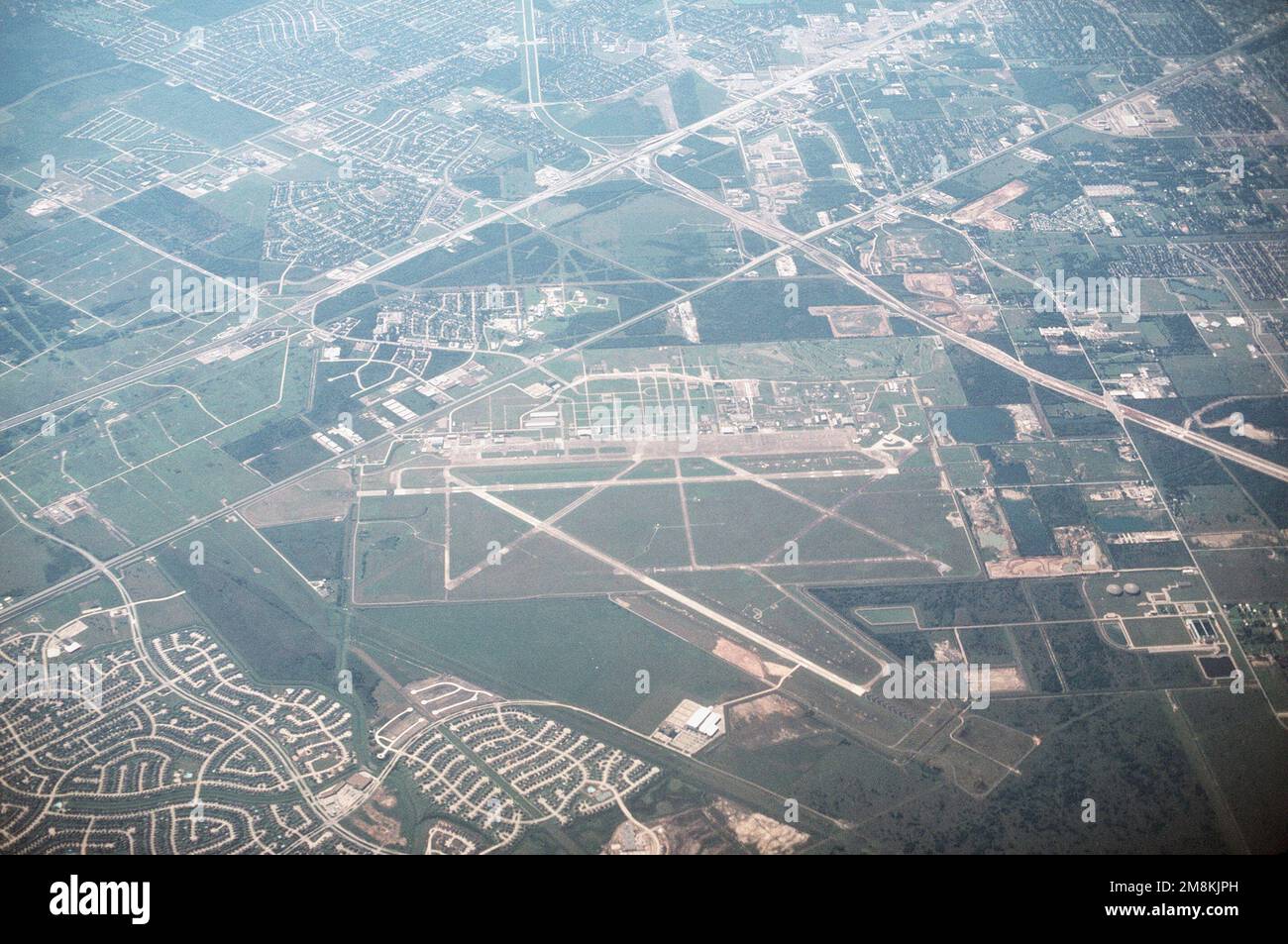 High oblique aerial view looking northwest. This joint use civil and ...