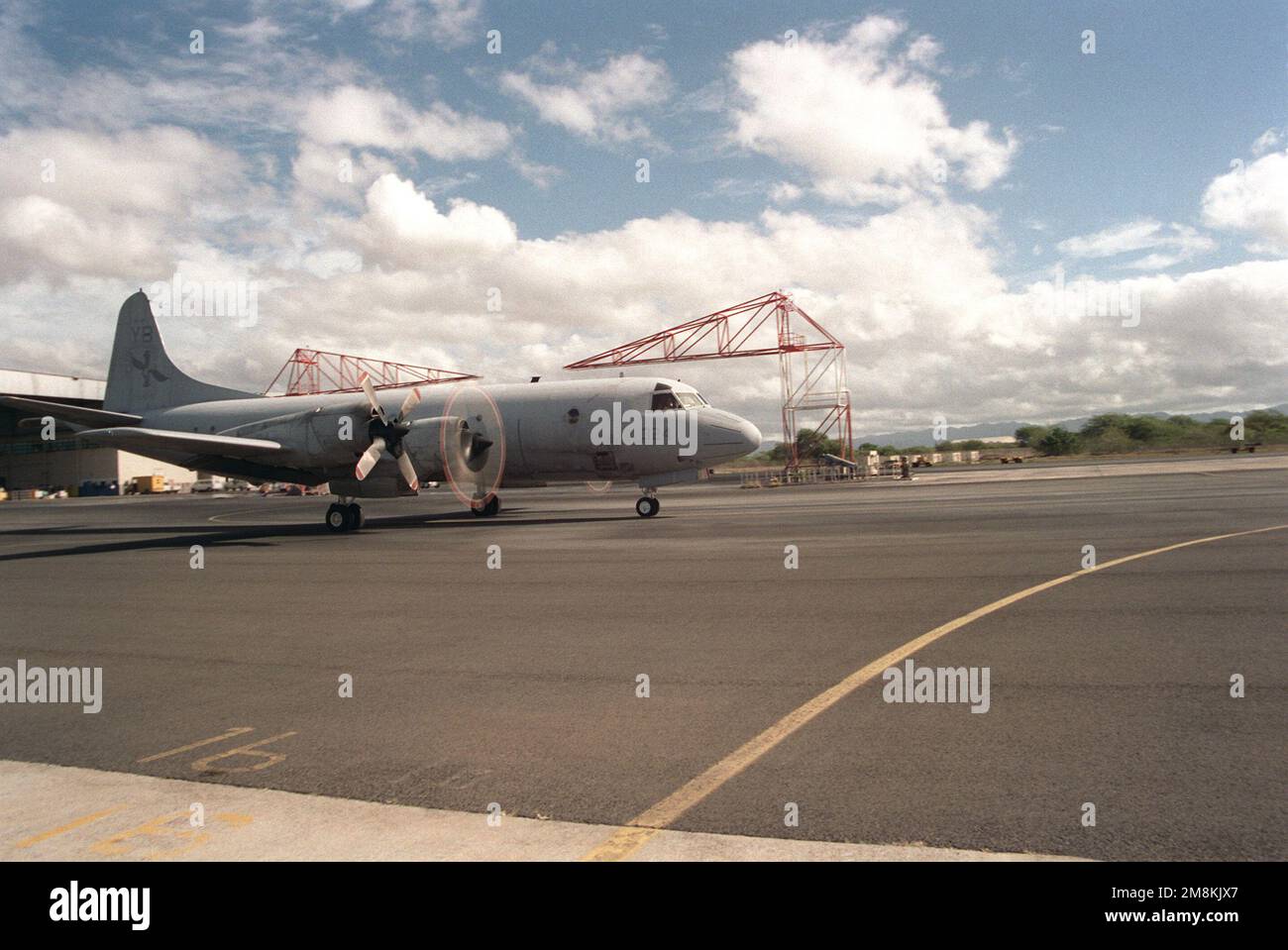 A P-3C Orion aircraft of Patrol Squadron 47 (VP-47) is running up its ...