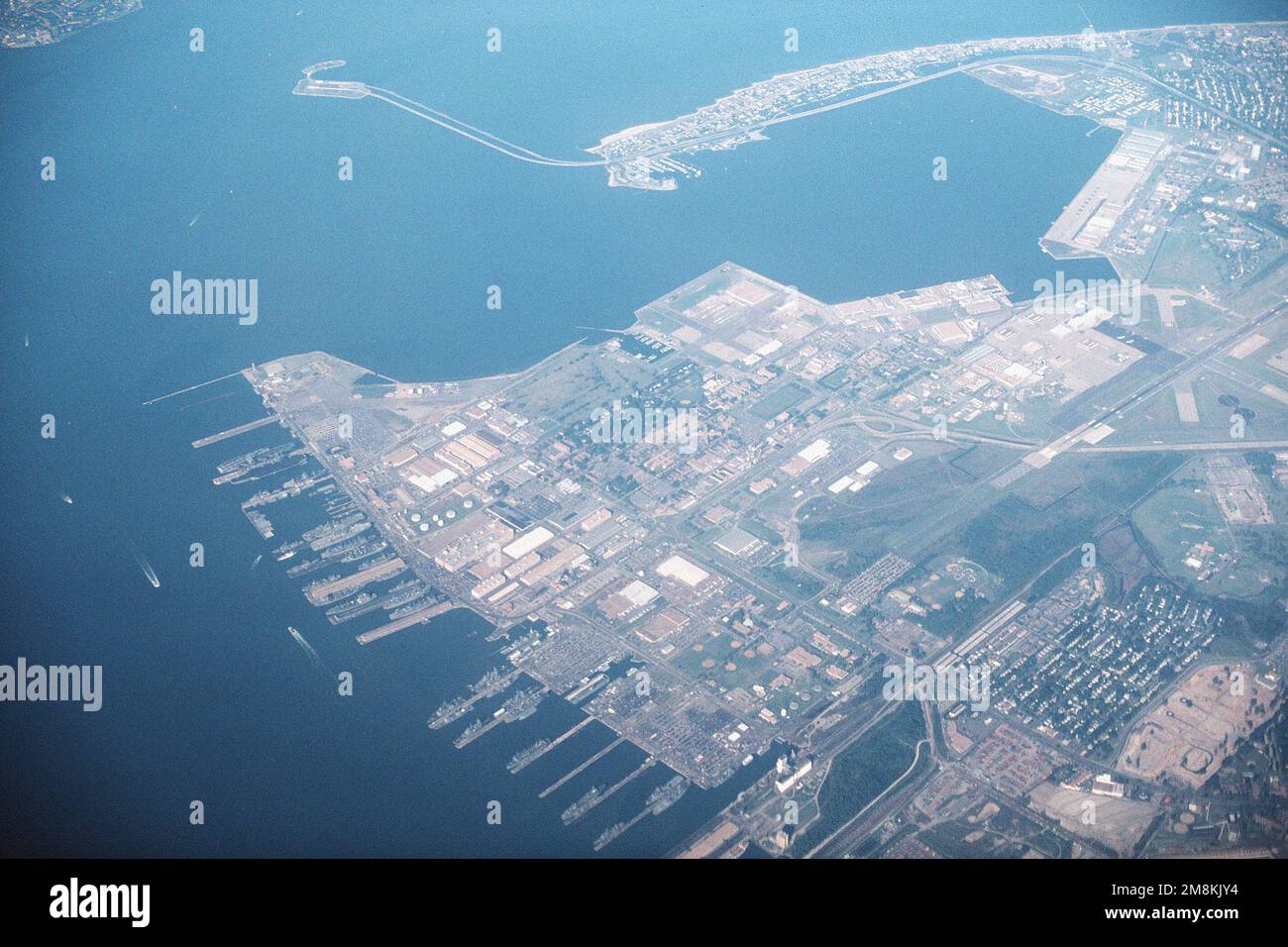 High oblique aerial view of the Naval Station looking east, towards the ...