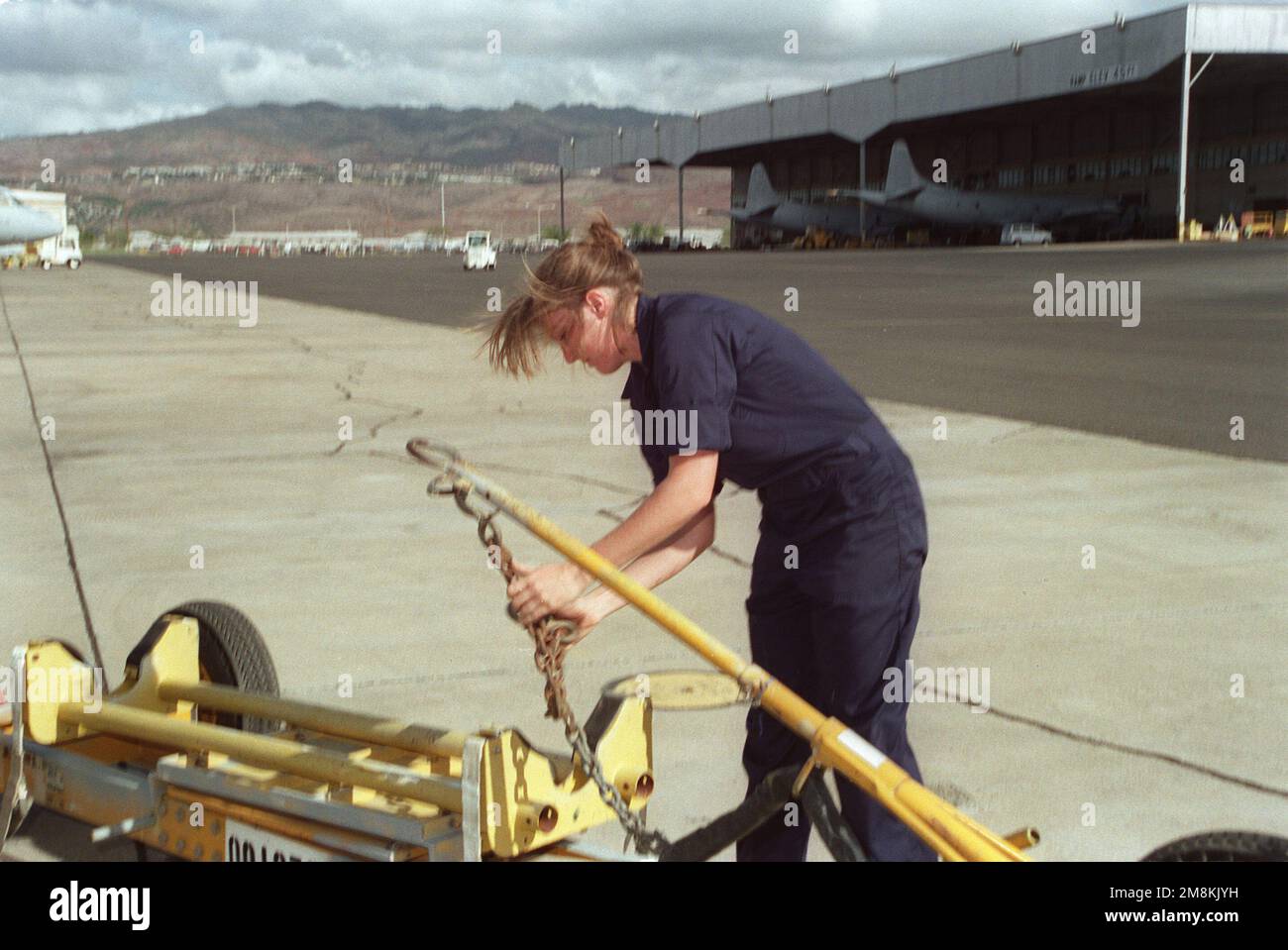 AIRMAN (AN) Diana Pitstick is unhooking a Mark 7 weapons cart from an ...