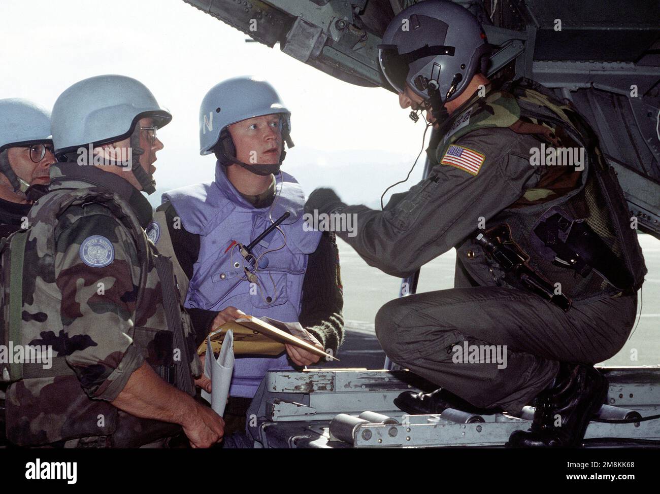 SENIOR AIRMAN Mike Decallo (right), U.S. Air Force, talks to United ...