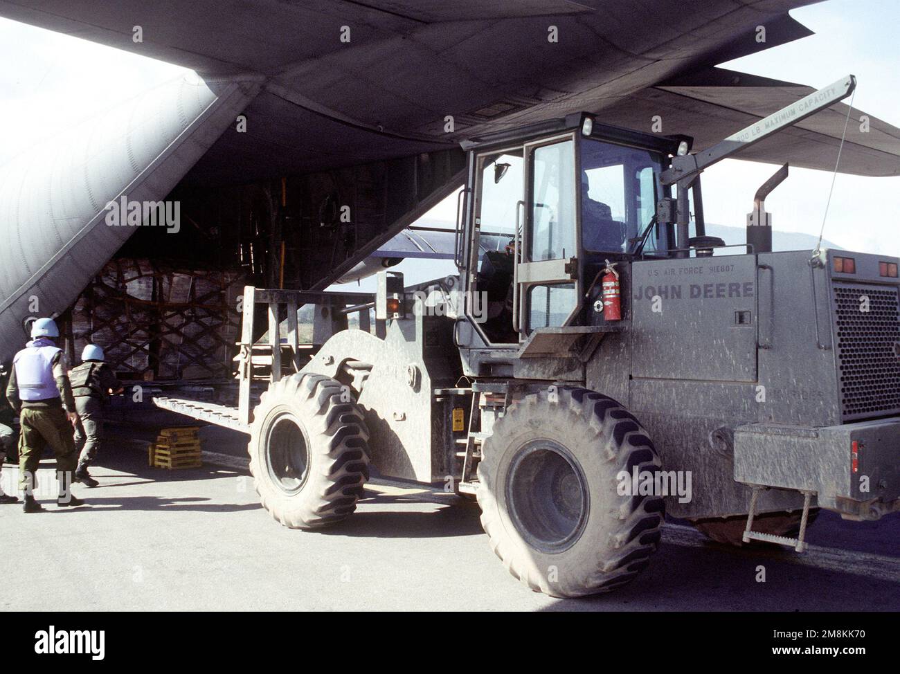 A United Nations ground crew member uses a M13K rough terrain forklift ...