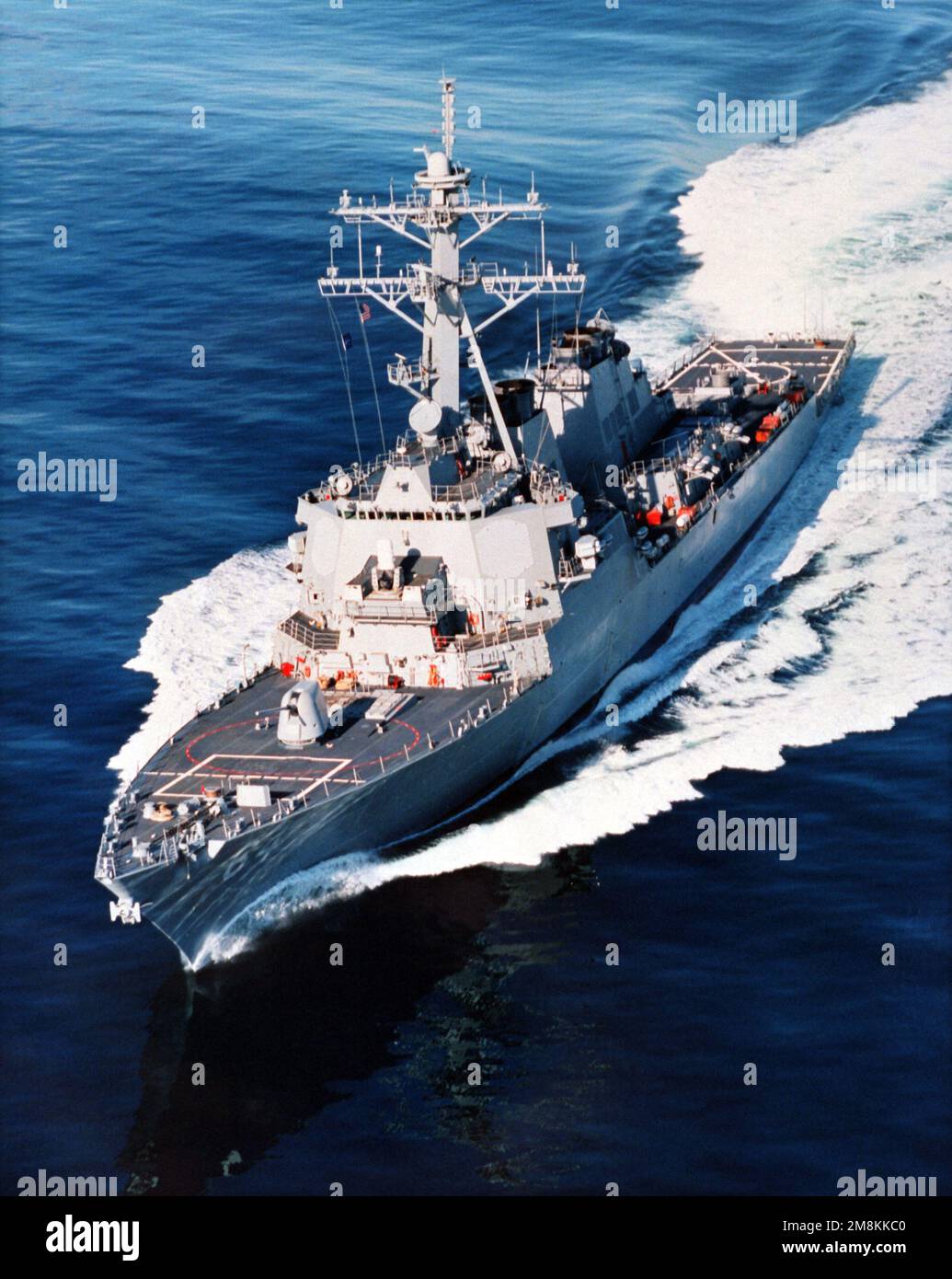 An aerial port bow view of the guided missile destroyer USS Carney (DDG ...