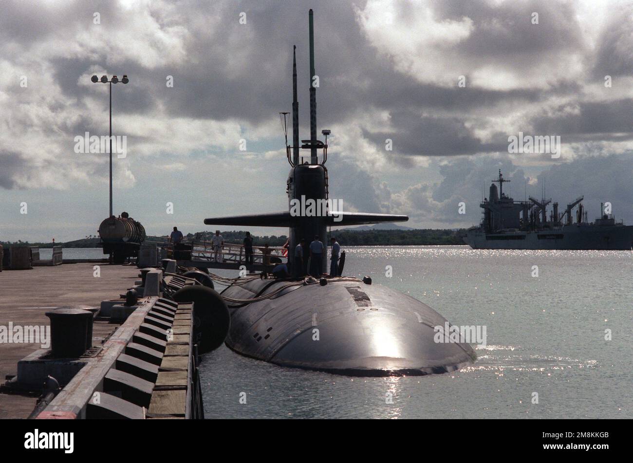 The nuclear-powered attack submarine USS Newport News (SSN-750) and the ...